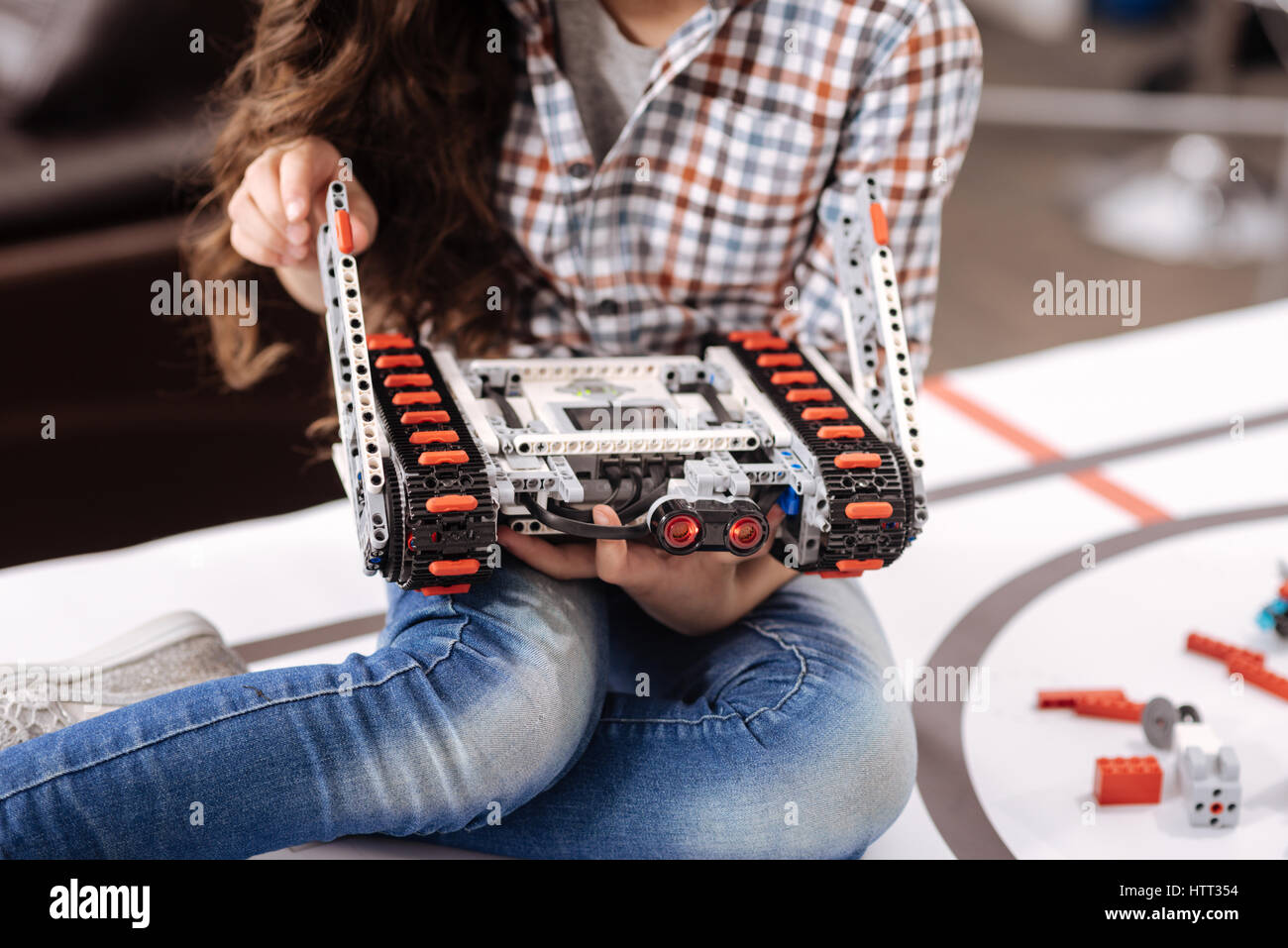 Little girl holding electronic toy at the robotics laboratory Stock ...