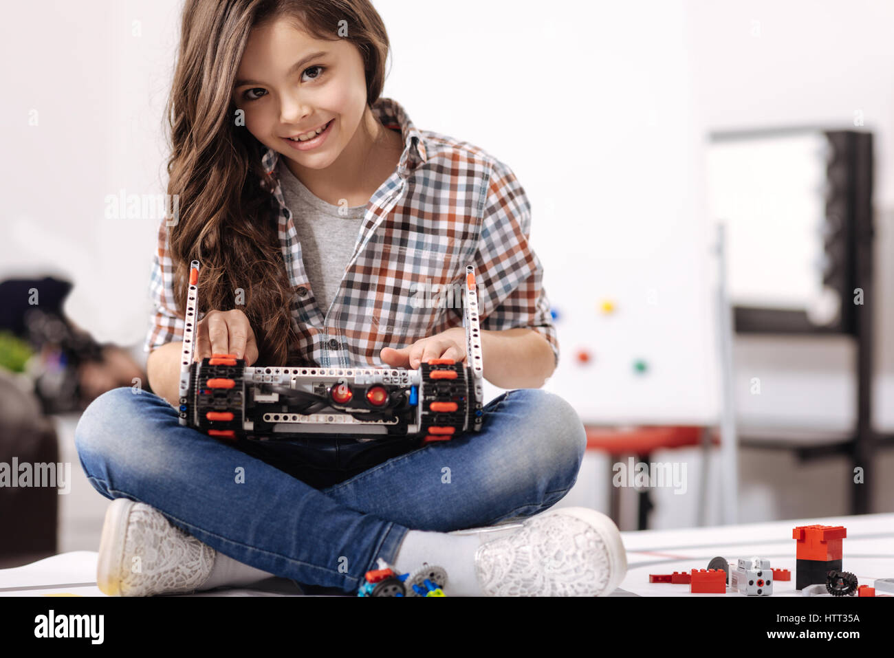 Sunny girl programming digital toy at the robotics laboratory Stock ...