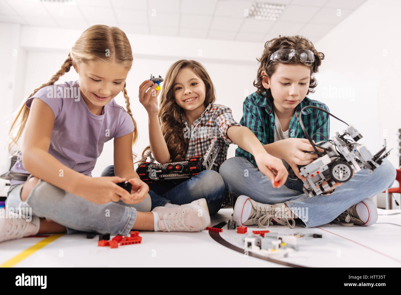 Intelligent children using gadgets and devices in the studio Stock ...
