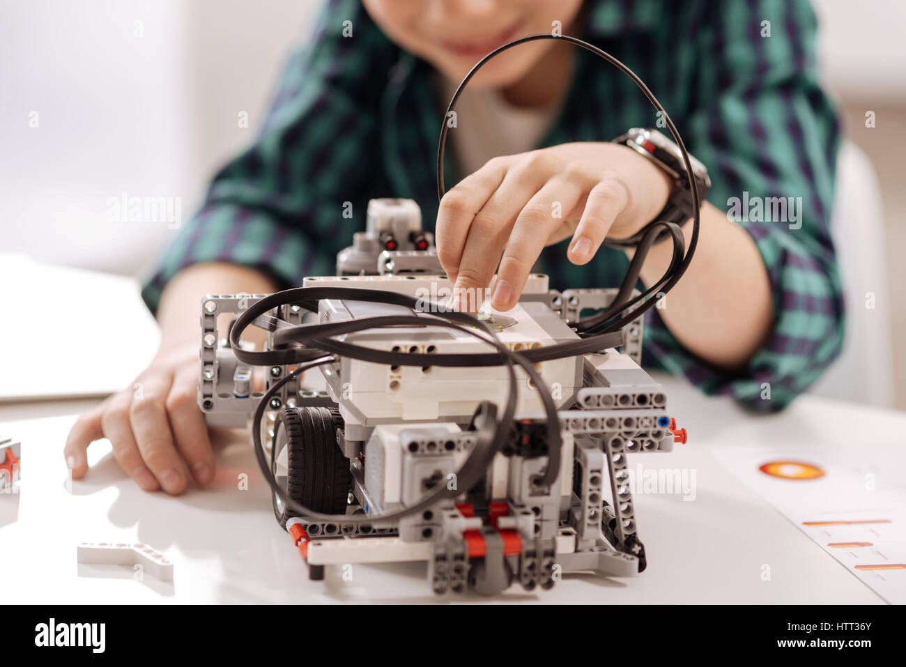 Gifted kid studying tech subject in the studio Stock Photo - Alamy