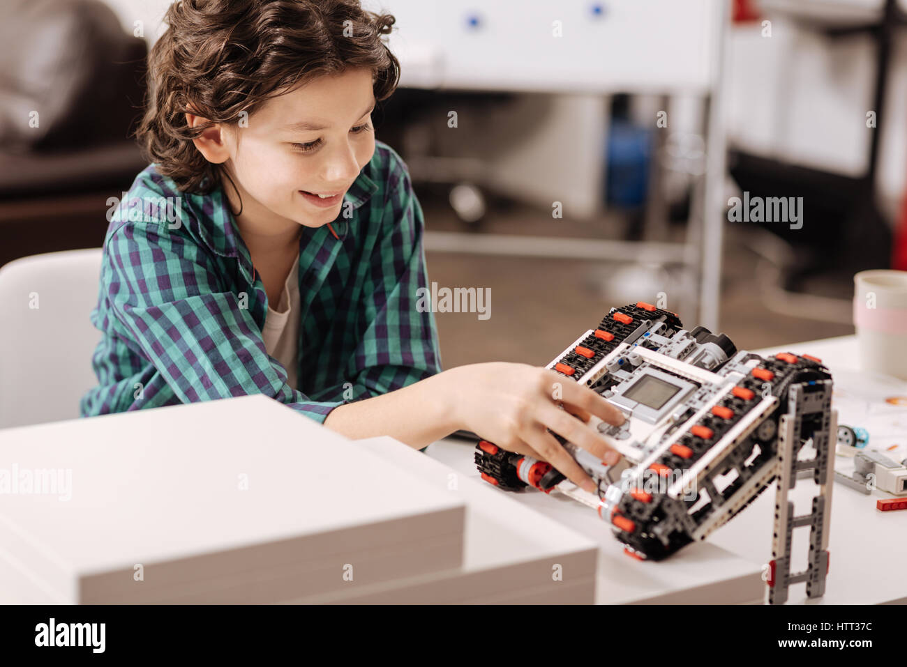 Smart child programming robot in the studio Stock Photo - Alamy