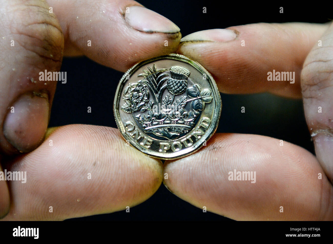 Editorial Use only Ð NO COMMERCIAL USE A 12-sided one pound coin in the ...
