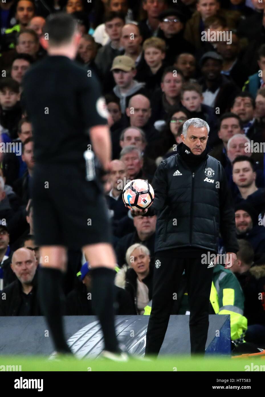 Manchester United manager Jose Mourinho (right) and referee Michael ...