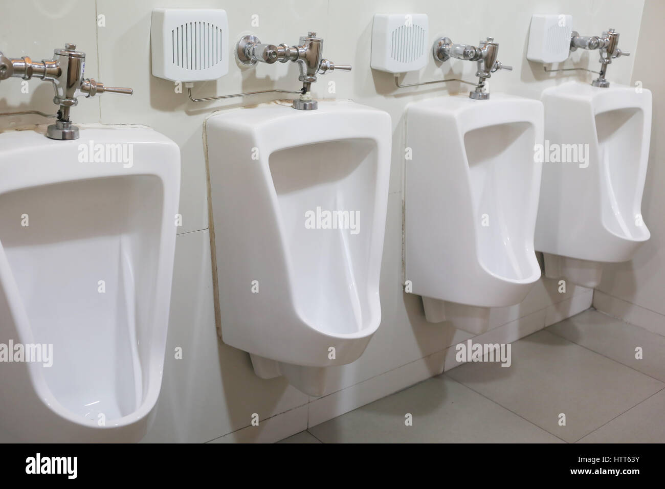 Modern urinal in men bathroom, white ceramic urinals for men in toilet ...