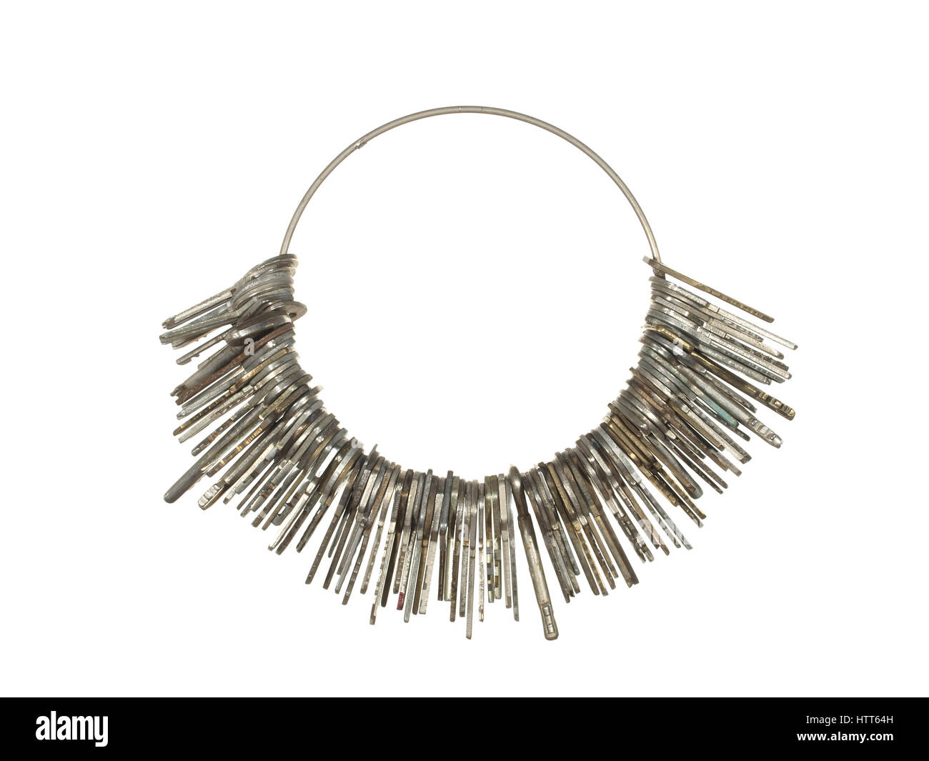Large bunch of various keys on a metal ring isolated on a white ...