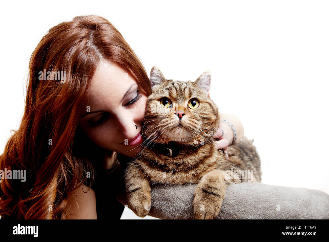 Beautiful girl with her cat on white background. People and pets ...