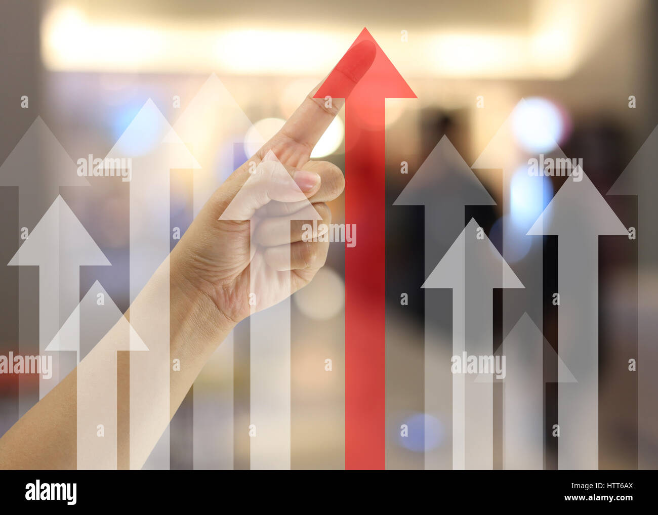 Hand of business man point to the highest point of the red arrow in ...
