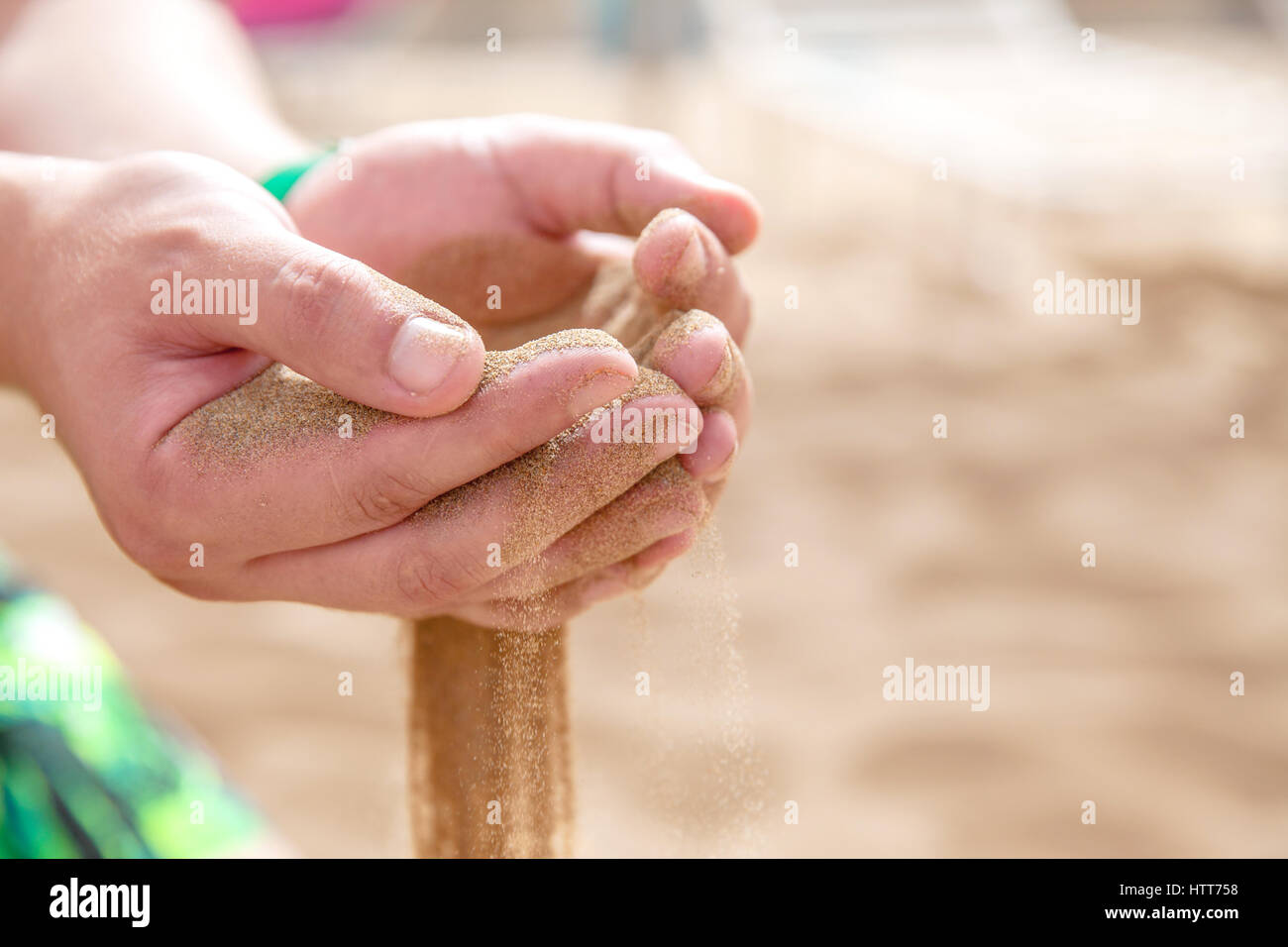 Sand falling through hands hi-res stock photography and images - Alamy