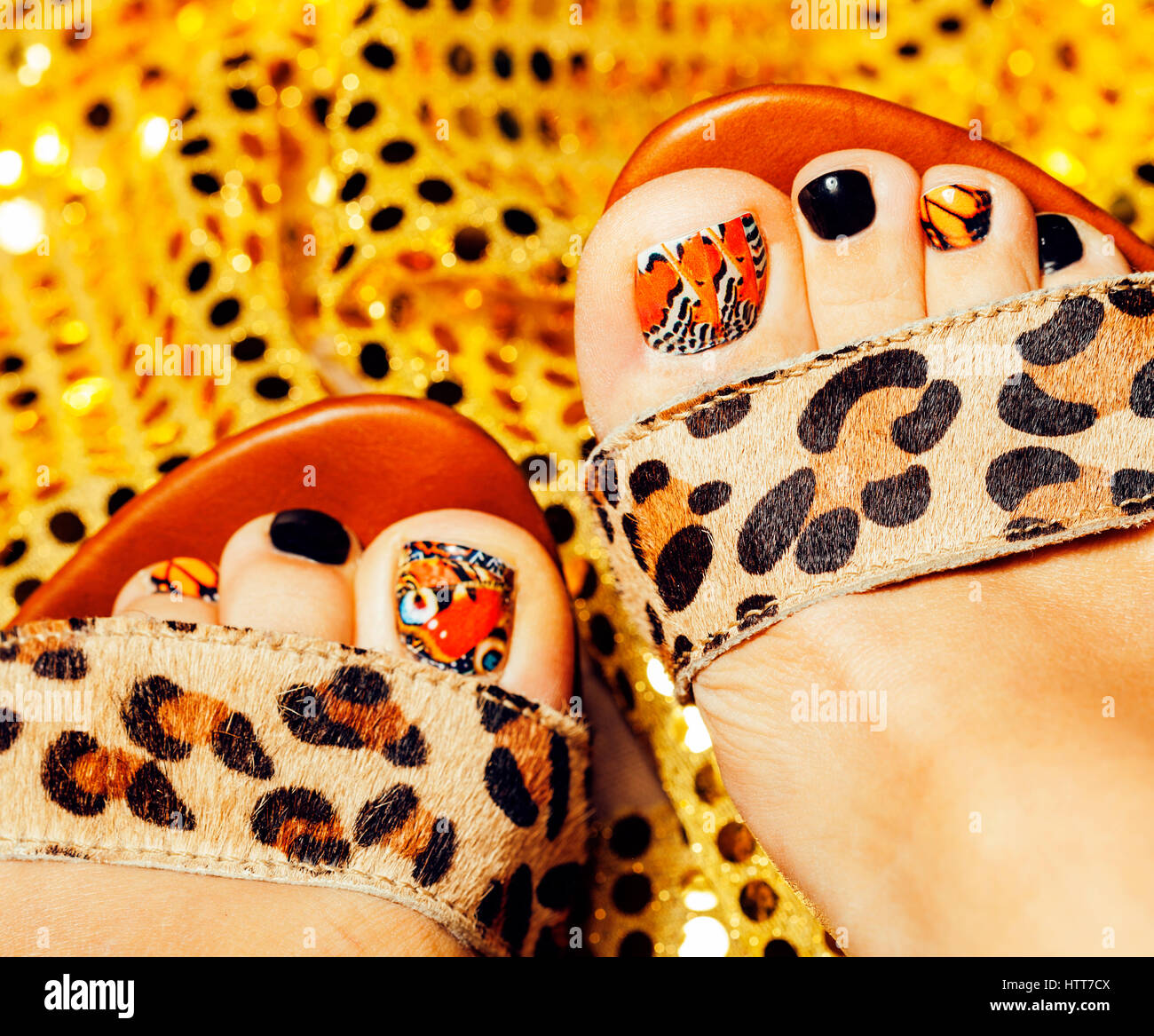 photo of pedicure like butterfly design on gold background close up ...
