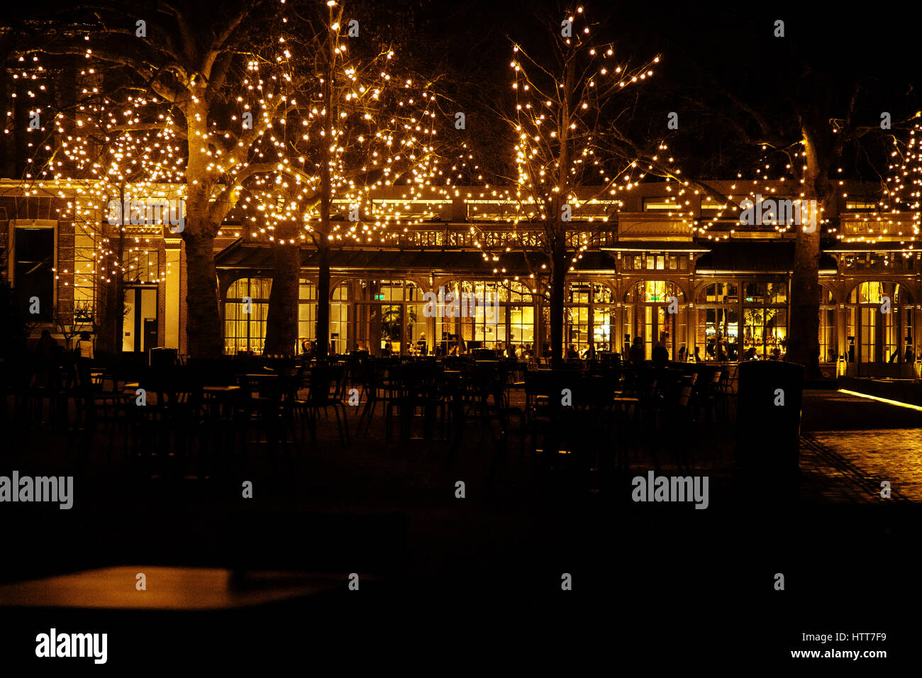 empty night restaurant, lot of tables and chairs with noone, magic ...