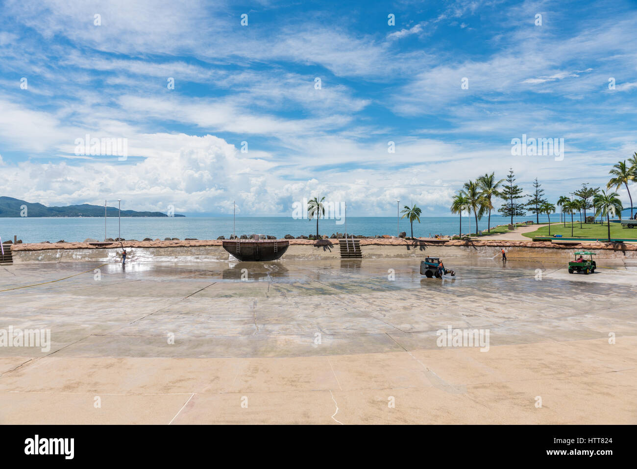 Workers on The Strand, Townsville, Australia, cleaning the public Rock ...