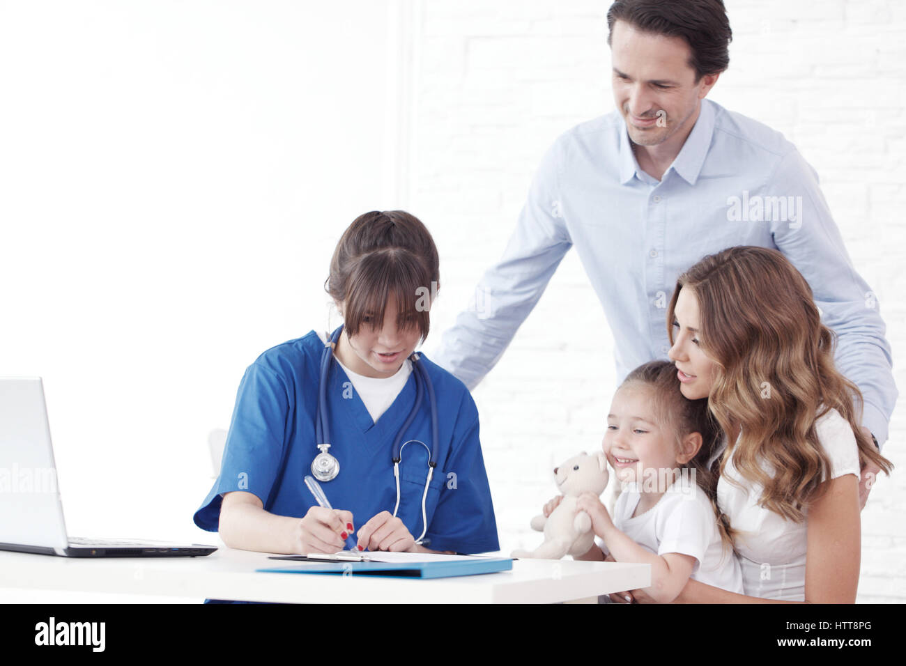 Young parents doctor hi-res stock photography and images - Alamy