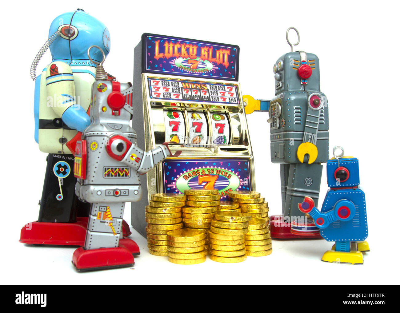 vintage robots gather around a old slot machine Stock Photo - Alamy