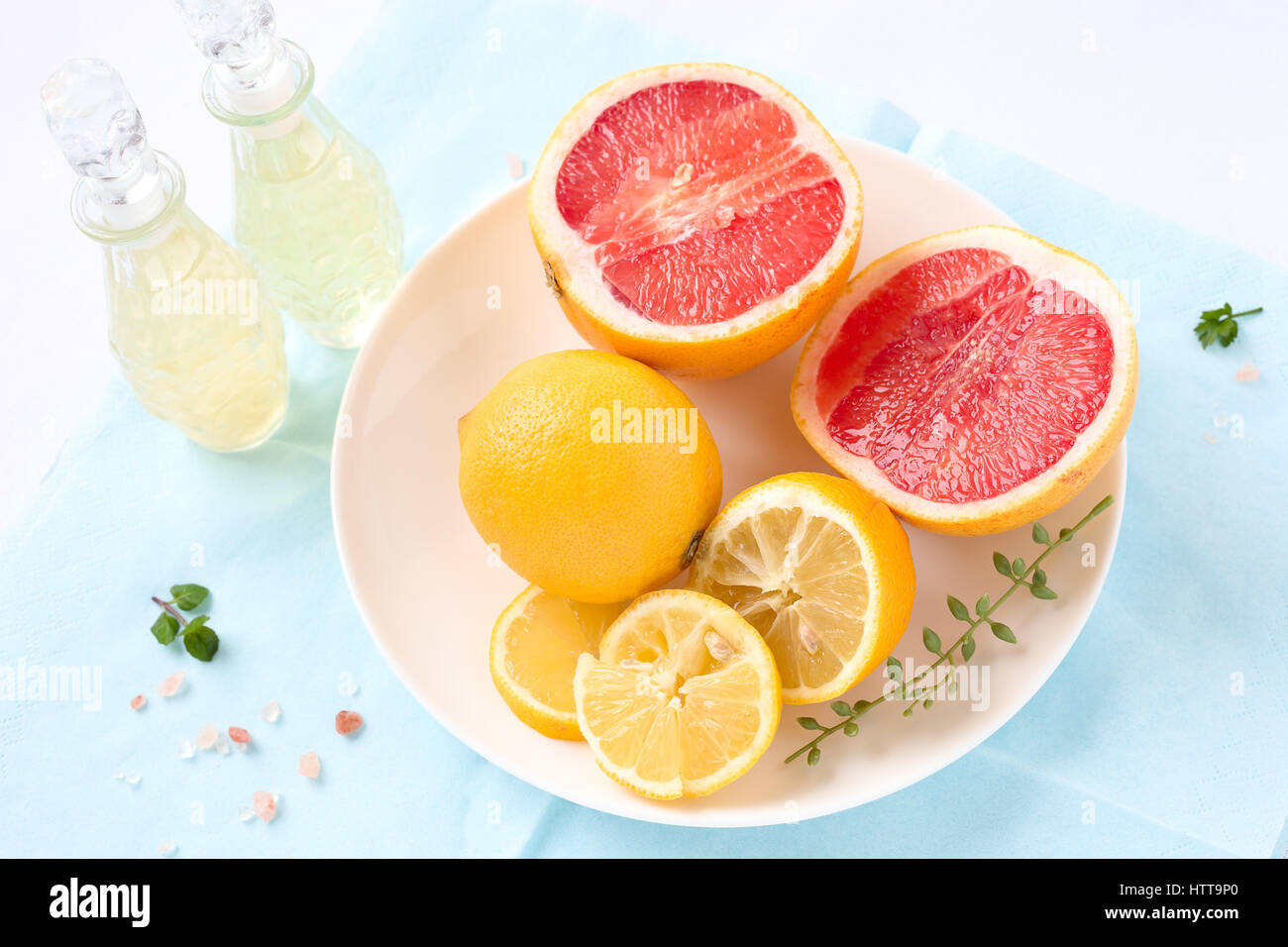 Lemon and red grapefruit on a plate Stock Photo - Alamy