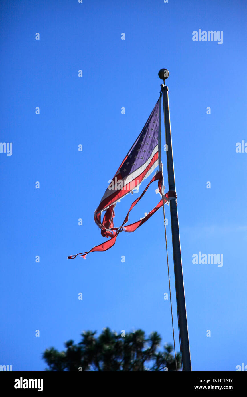 A tattered American flag symbolizes the republic's distress Stock Photo ...