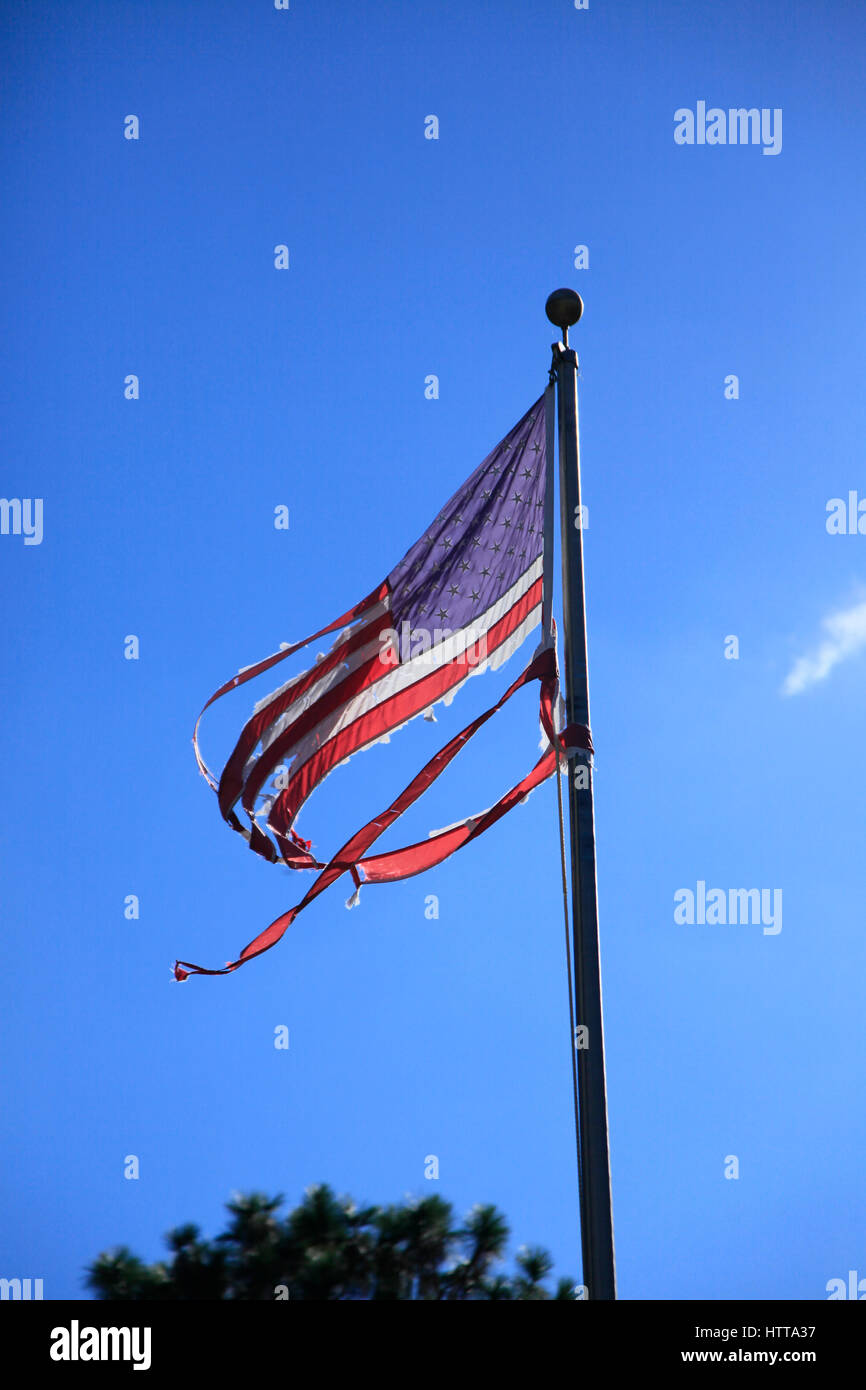A tattered American flag symbolizes the republic's distress Stock Photo ...