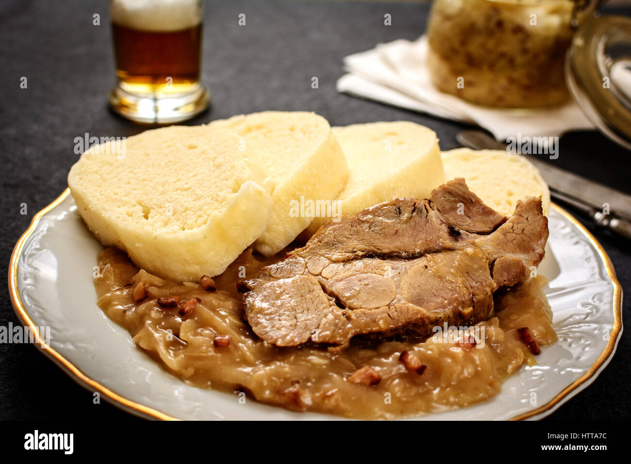 Czech traditional cuisine dumplings cabbage and pork meat and beer on ...
