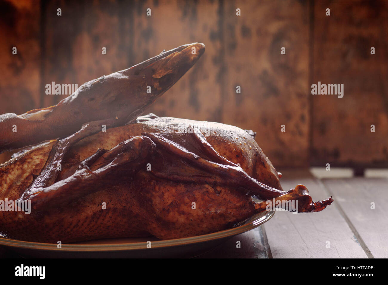 Roast duck on a hot plate in the kitchen Stock Photo - Alamy