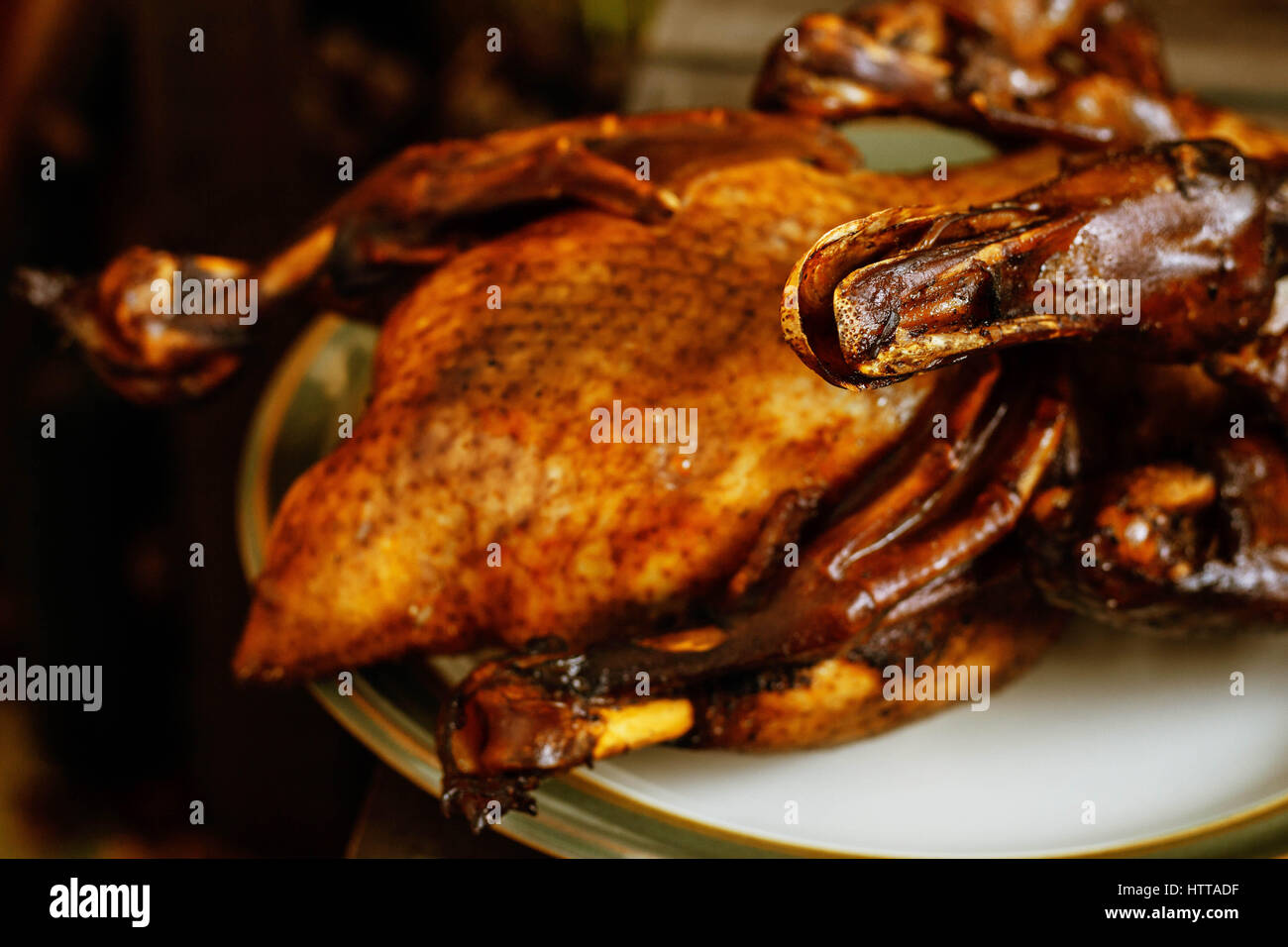 Roast duck on a hot plate in a restaurant Stock Photo - Alamy