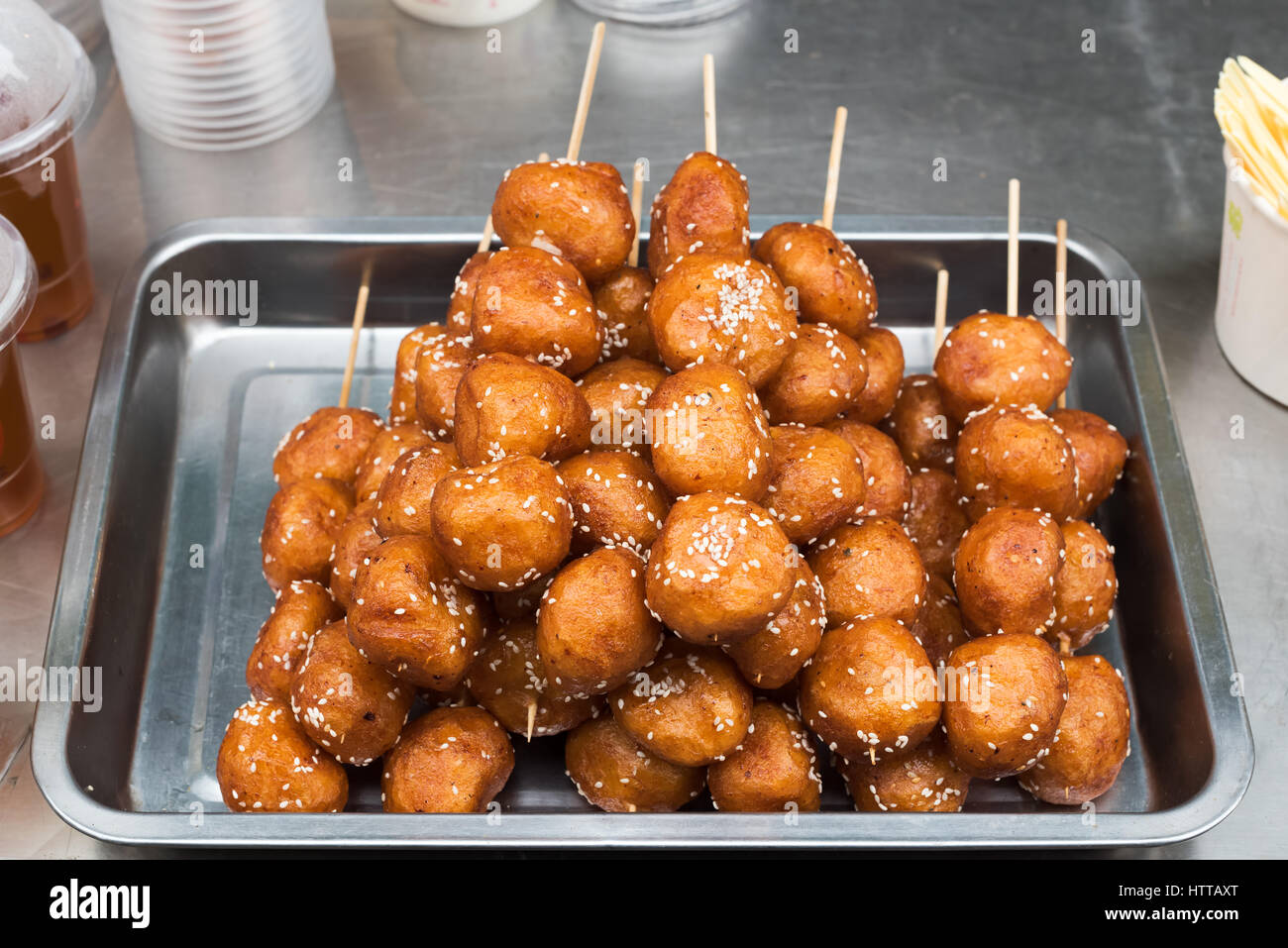 Sesame rice balls skewers - chinese street food Stock Photo - Alamy