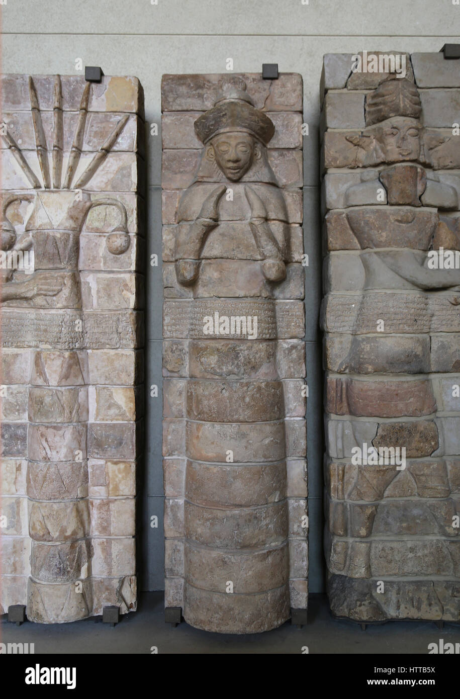 Elam. Moulded clay brick panel: God and goddess. Temple of Inshushinak ...