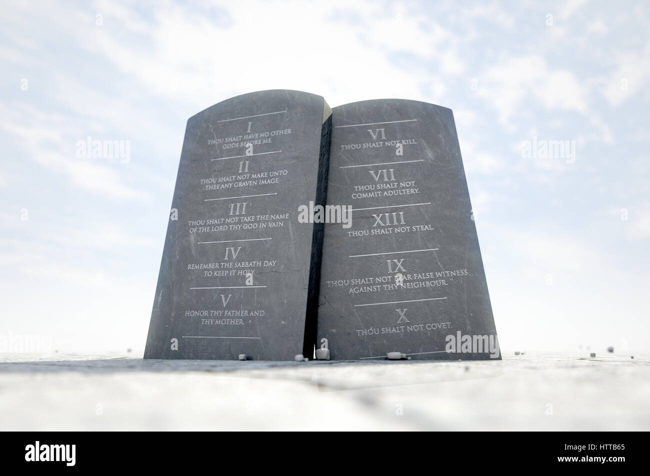 Two stone tablets with the ten commandments inscribed on them standing ...
