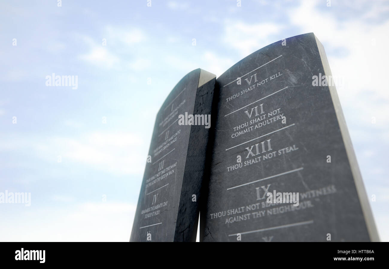 Two stone tablets with the ten commandments inscribed on them standing ...