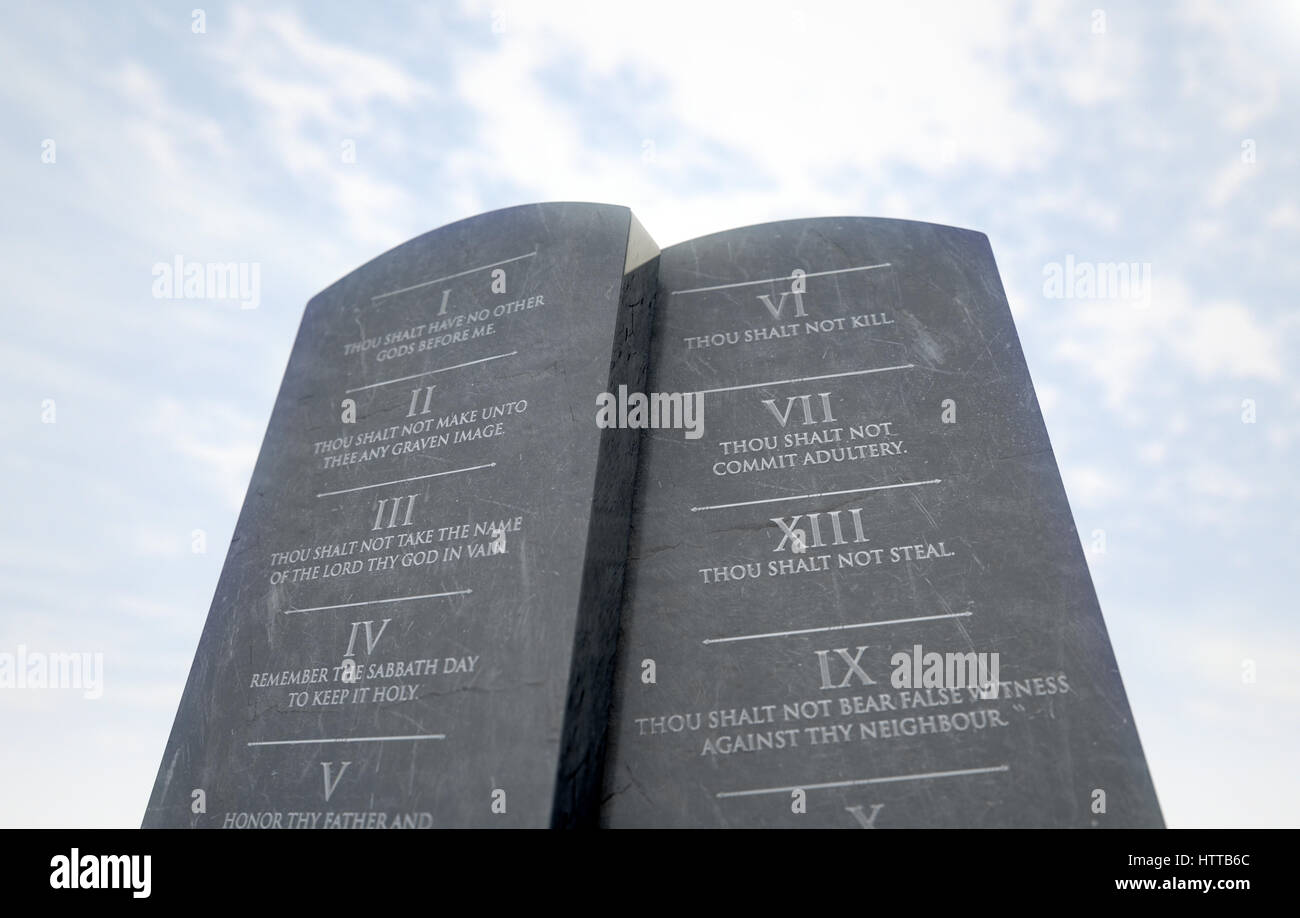 Two stone tablets with the ten commandments inscribed on them standing ...