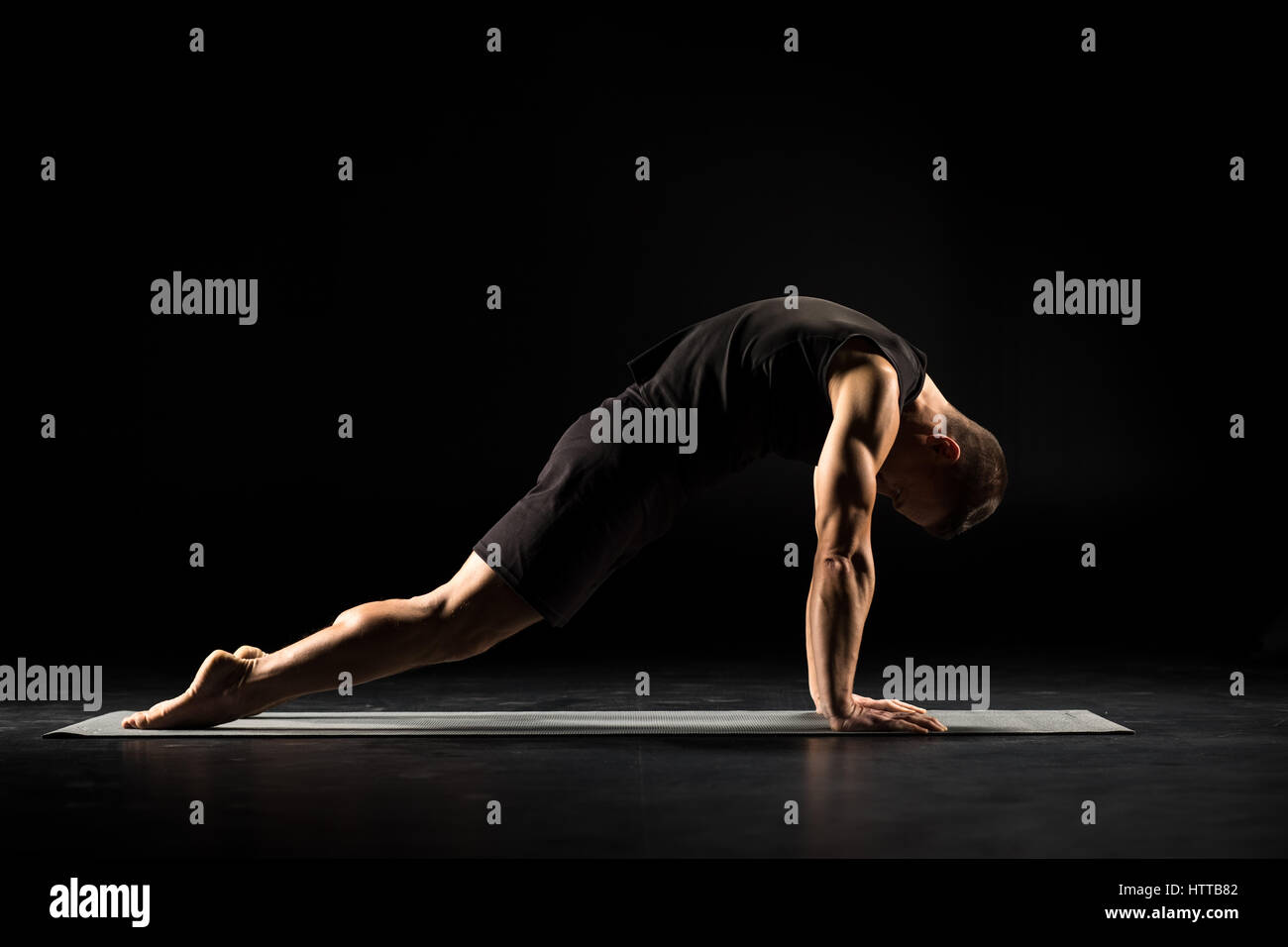 Man standing in yoga position Stock Photo - Alamy
