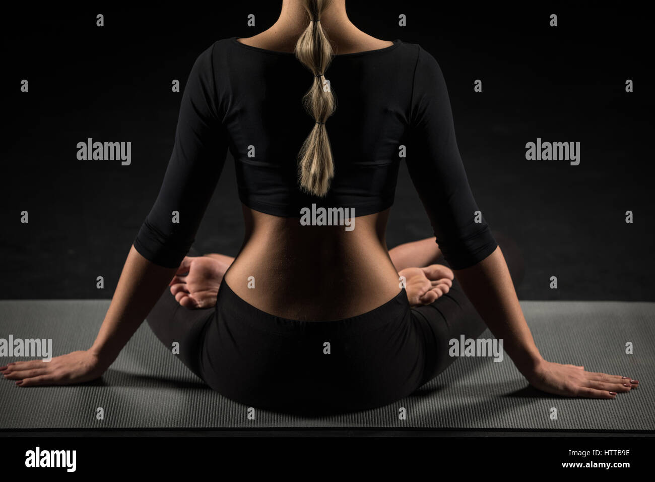 Woman sitting in lotus position Stock Photo - Alamy