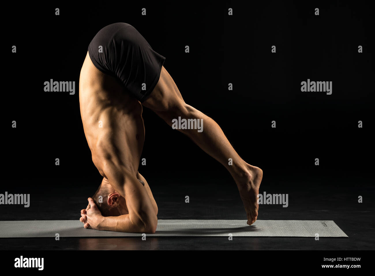 Man standing in yoga position Stock Photo - Alamy