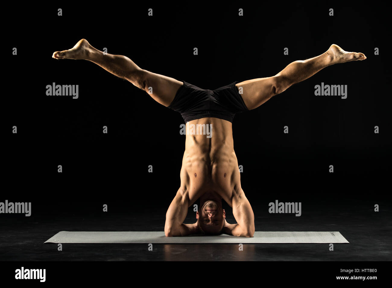 Man standing in yoga position Stock Photo - Alamy