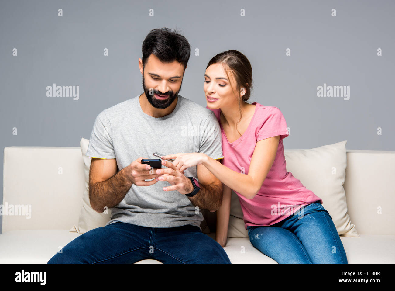 Couple using smartphones Stock Photo - Alamy