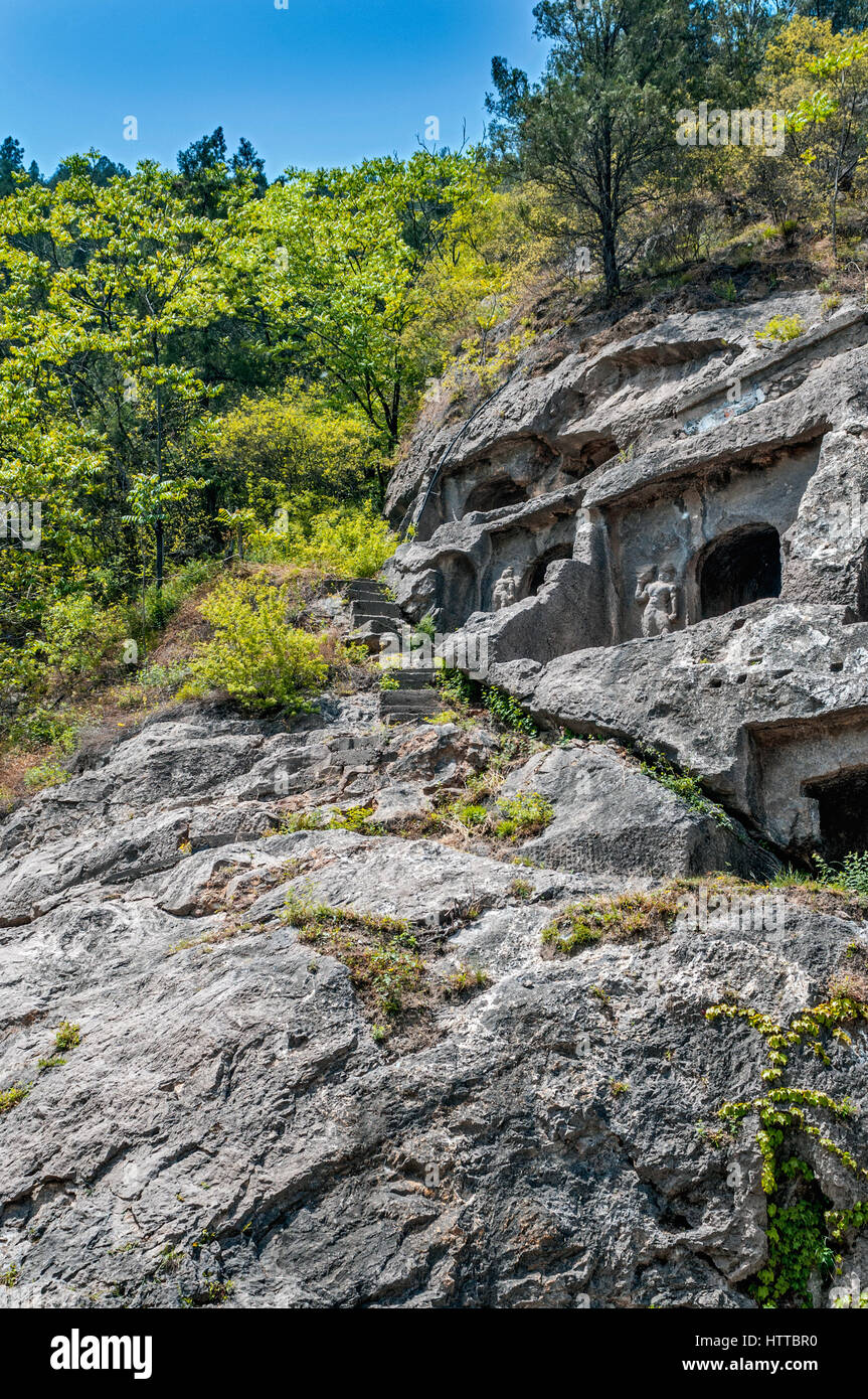 Luoyang . Longmen Grottoes is one of the three major cave - temple ...