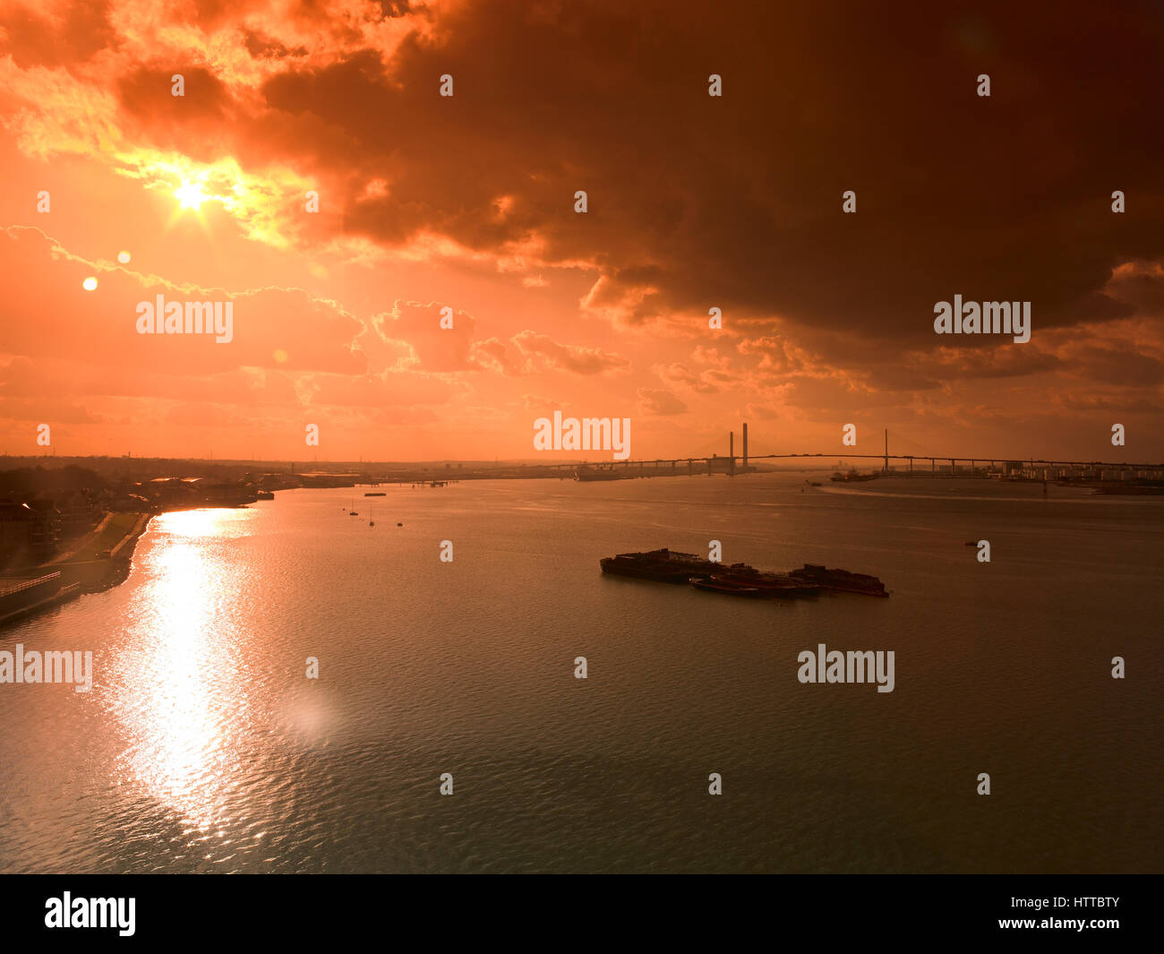 Sunset over estuary Stock Photo - Alamy
