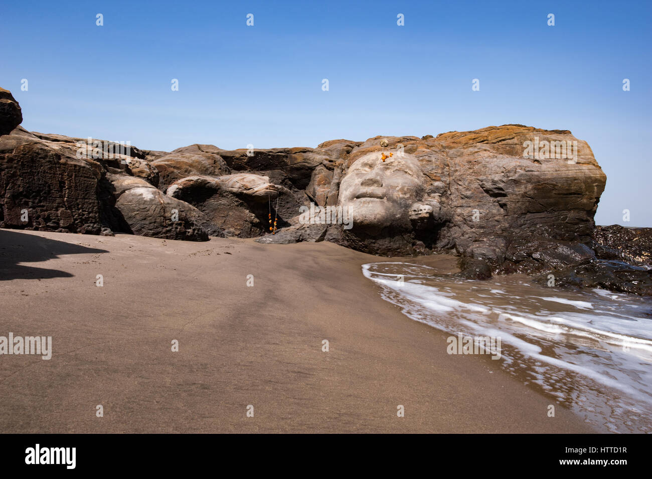 Vagator Beach in North Goa, face of Shiva carved in to a large rock ...