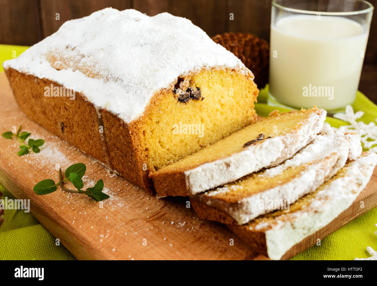 Freshly baked homemade loaf cake, decorating the top with powdered ...