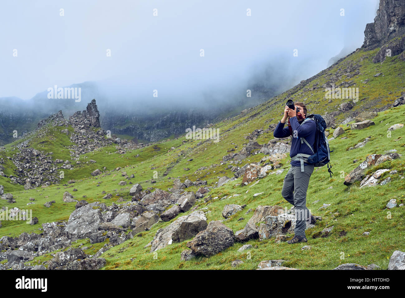 Man taking images of the beautiful scottish landscape Stock Photo - Alamy