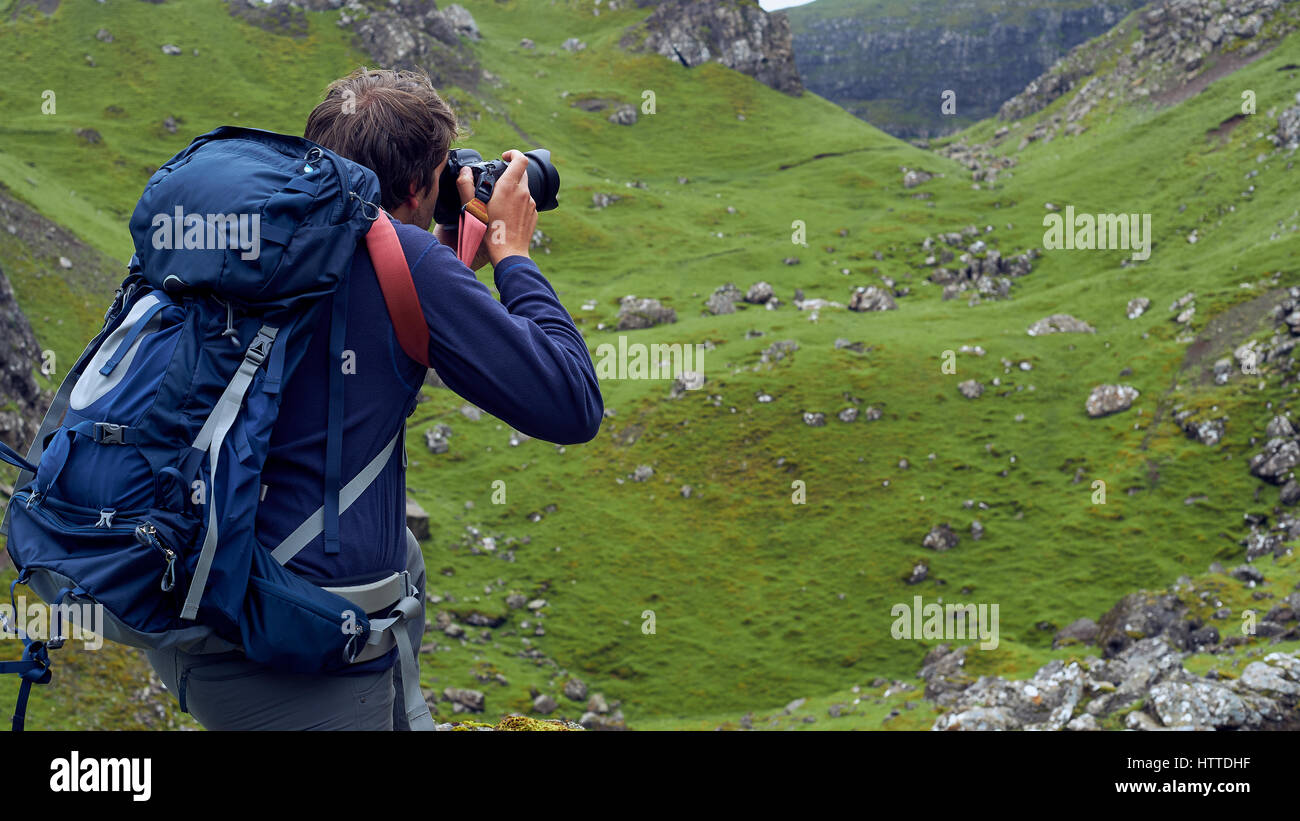 Man taking images of the beautiful scottish landscape Stock Photo - Alamy
