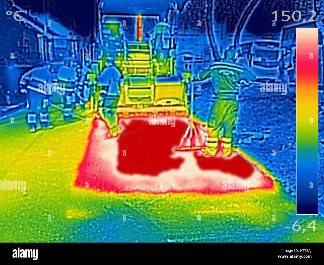 Infrared thermovision image showing Workers on Asphalting paver machine ...