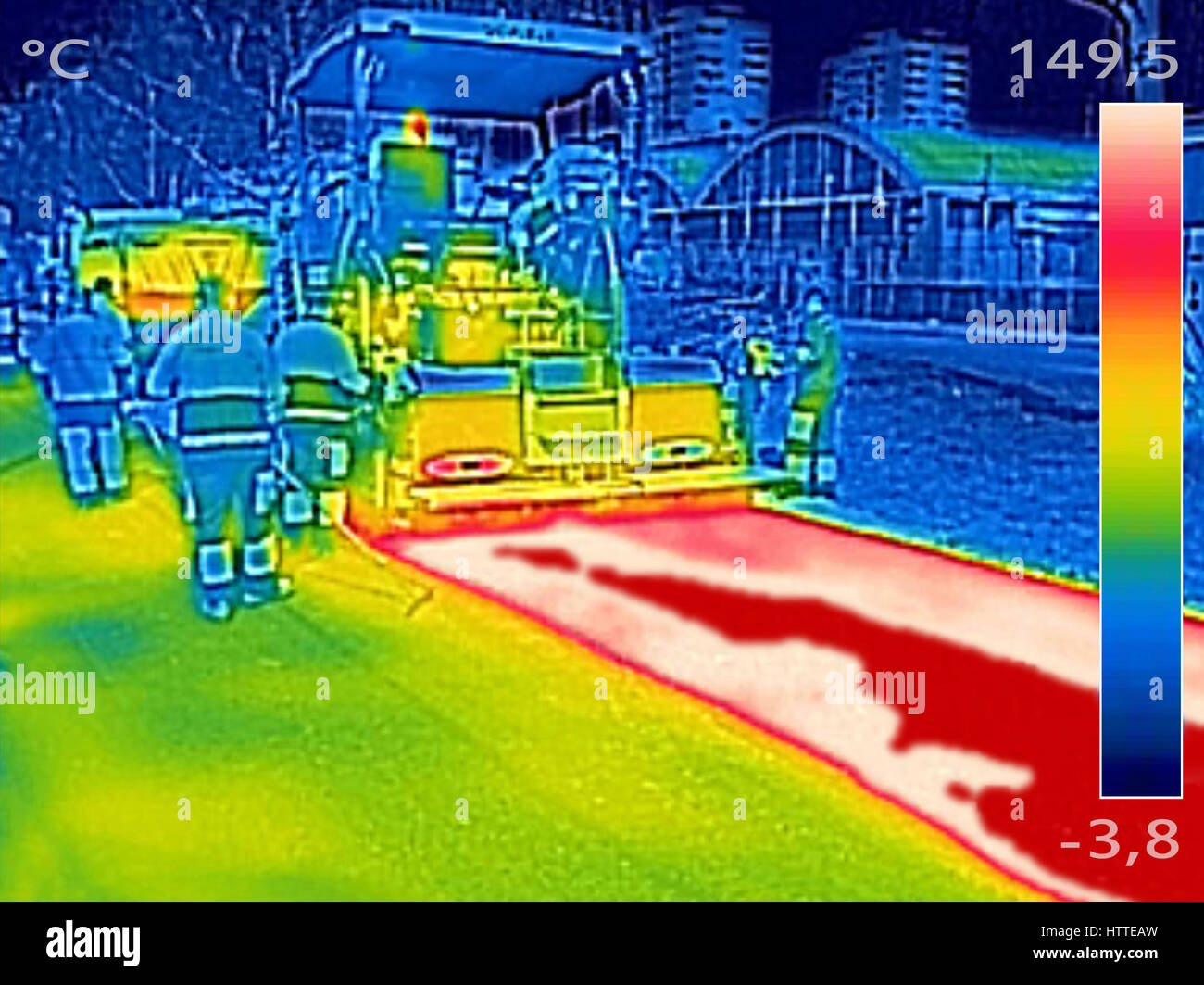 Infrared thermovision image showing Workers on Asphalting paver machine ...