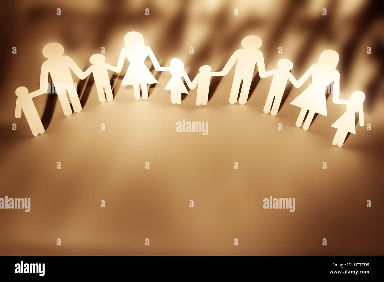 Family paper chain cutout holding hands Stock Photo - Alamy