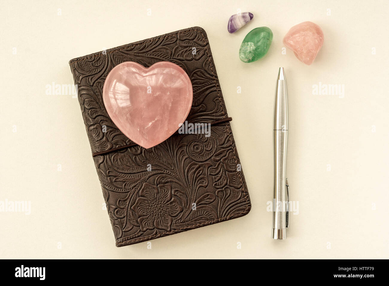 Crystals, pen and a journal for recording spiritual events Stock Photo ...