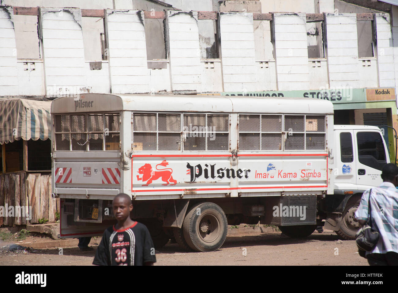 A beer lorry making a delivery at the market in Kibera slums, Nairobi ...