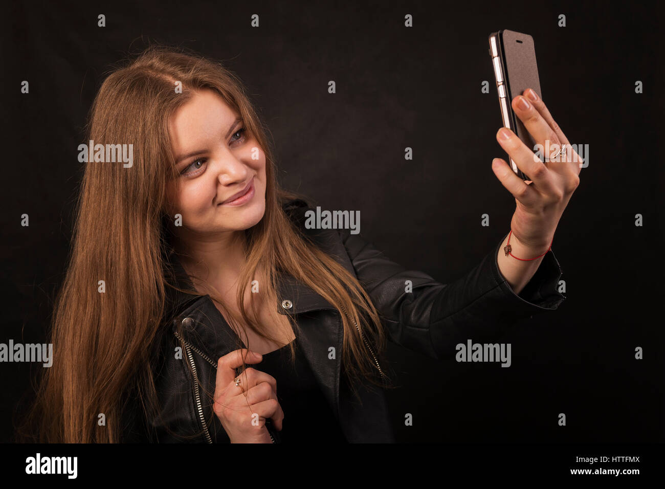 A girl self portrait using her mobile phone Stock Photo - Alamy