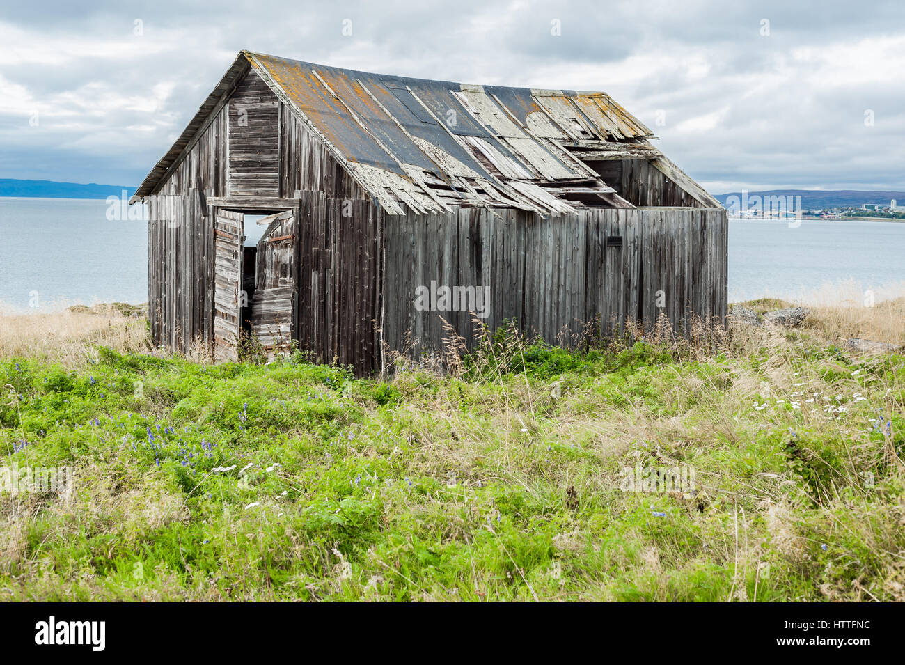Old wooden decrepit cabin in need of repair with damaged roof and broken door Stock Photo - Alamy