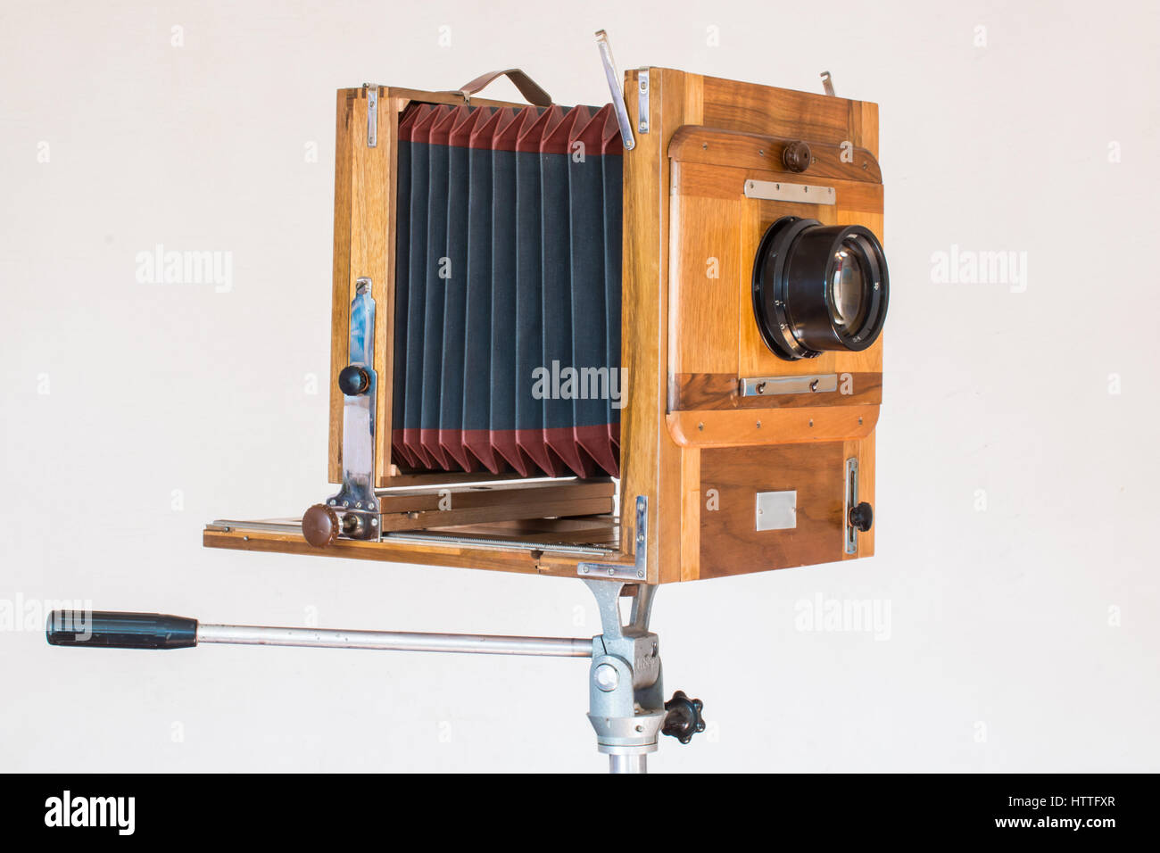 Old big vintage camera of wood and metal close on white background ...