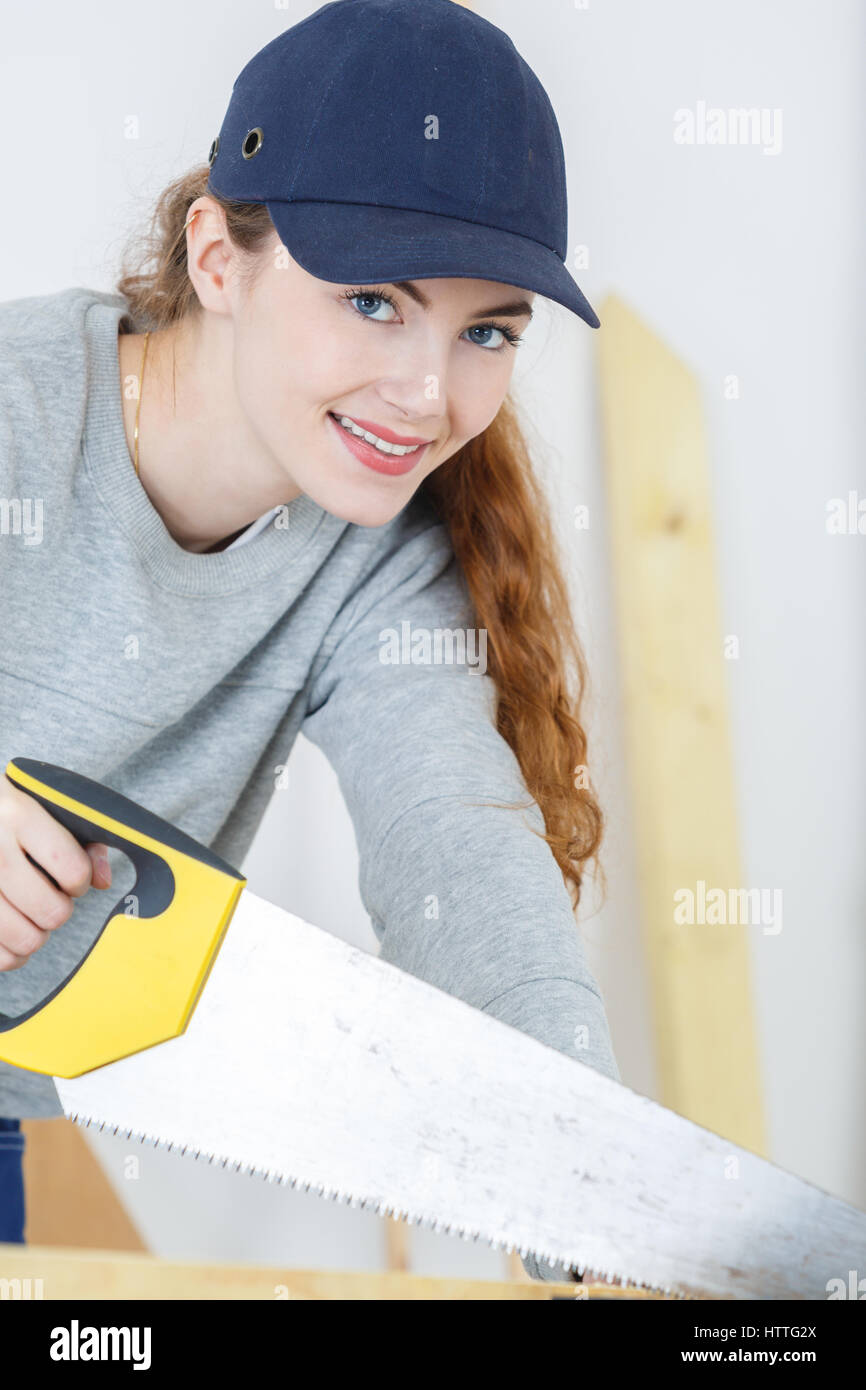 Lady using handsaw Stock Photo - Alamy