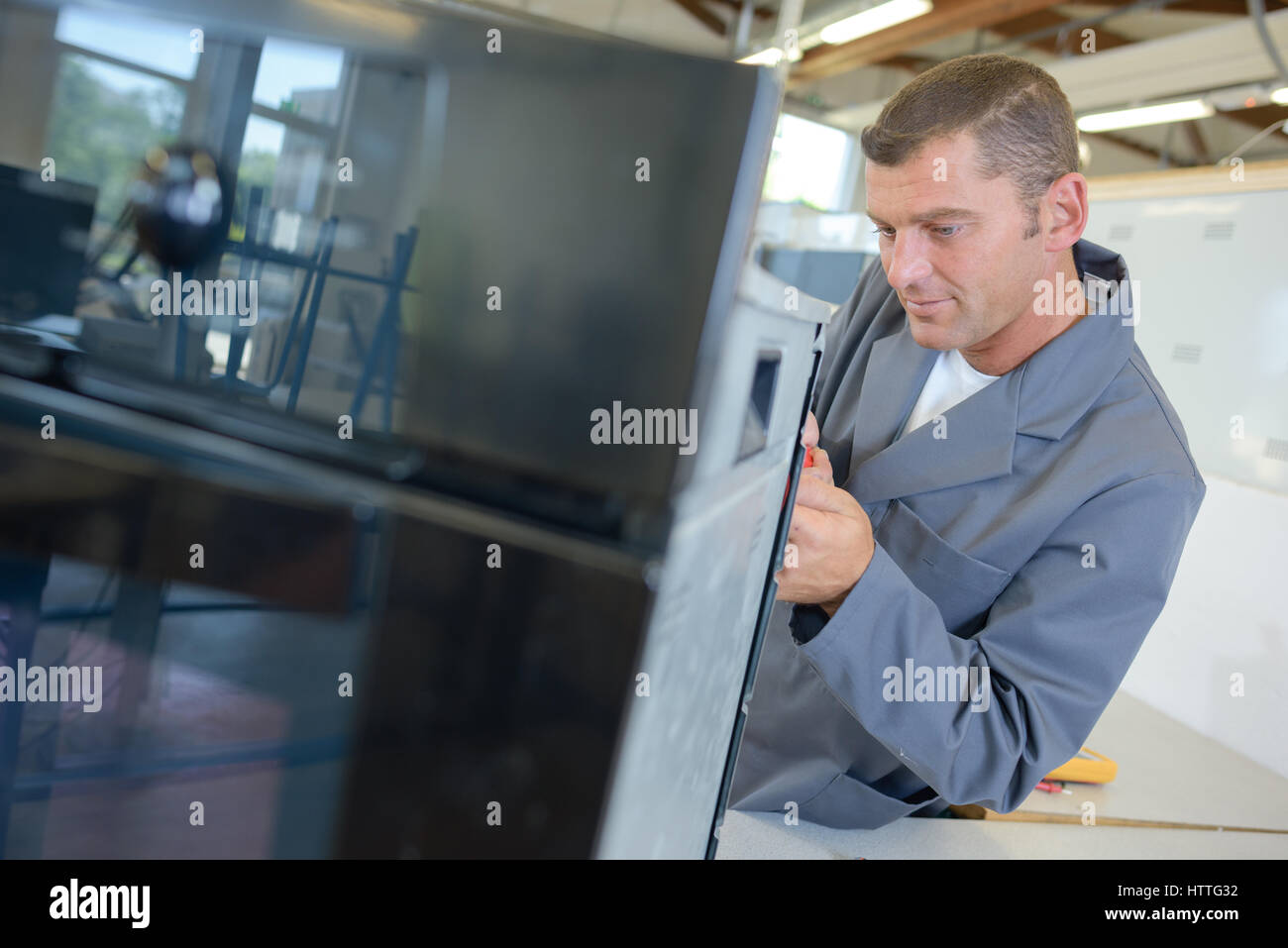 appliance production worker Stock Photo - Alamy