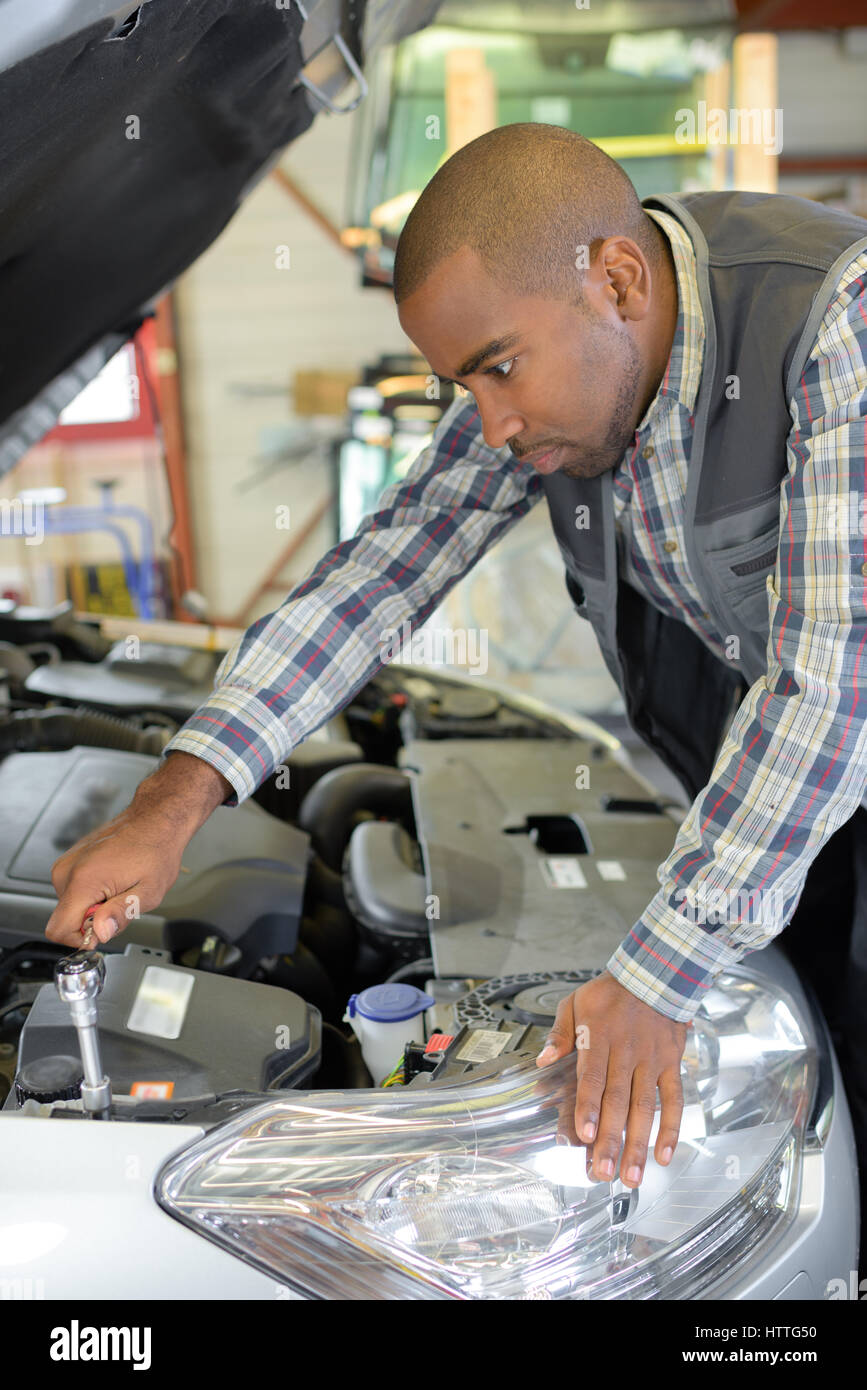 mechanic fixing a car Stock Photo - Alamy